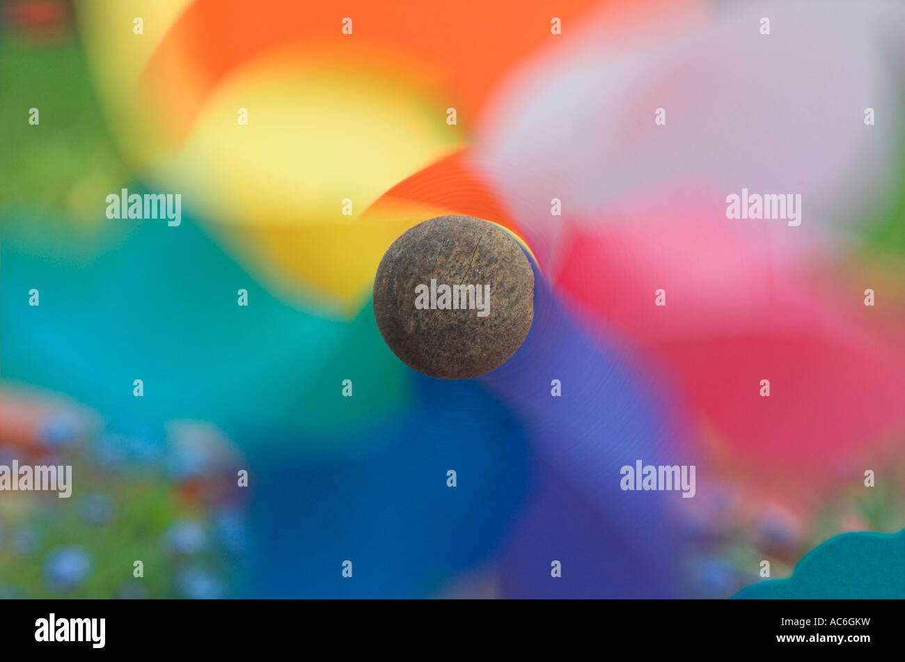 Multi coloured child s windmill spinning in the wind Stock Photo - Alamy