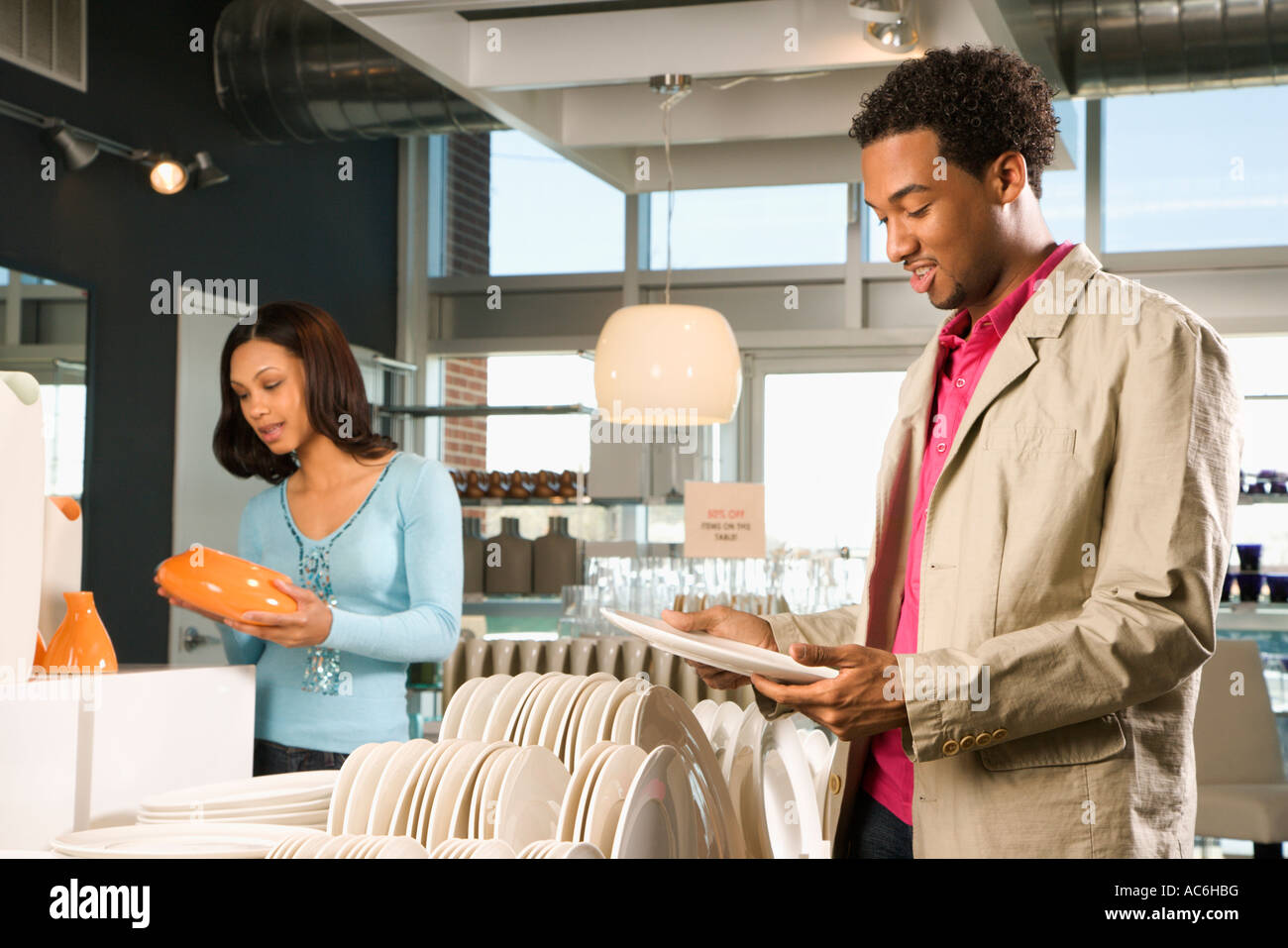 African American couple shopping in a home furnishings retail store ...