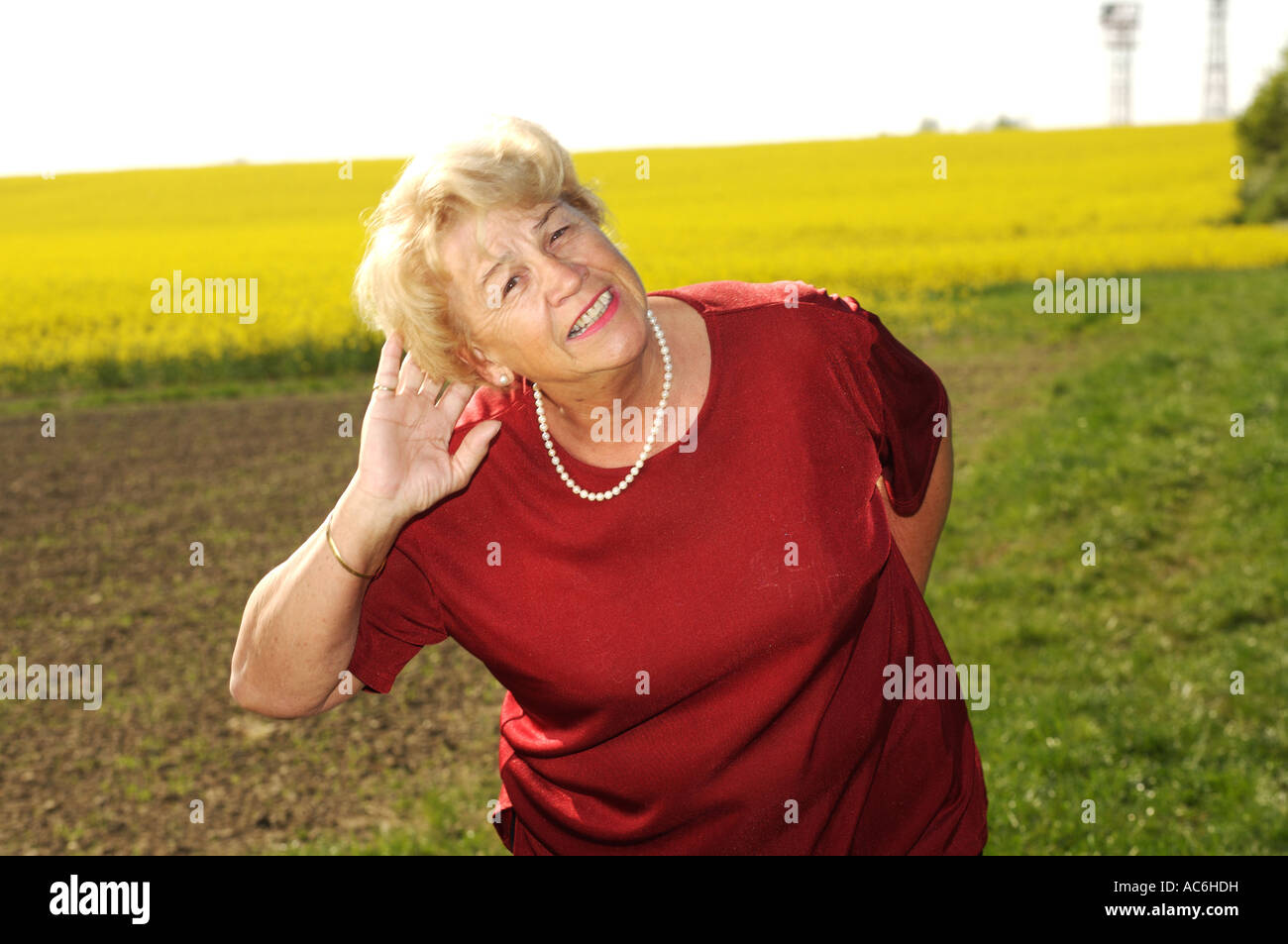Alte Dame vor Rapsfeld old lady in front of a rape field Stock Photo ...
