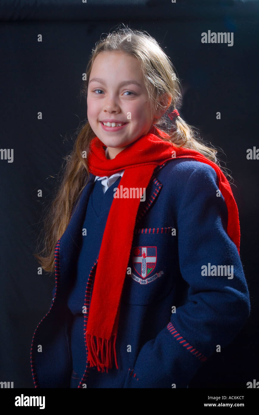 Young schoolgirl in private school uniform and red scarf Stock Photo ...