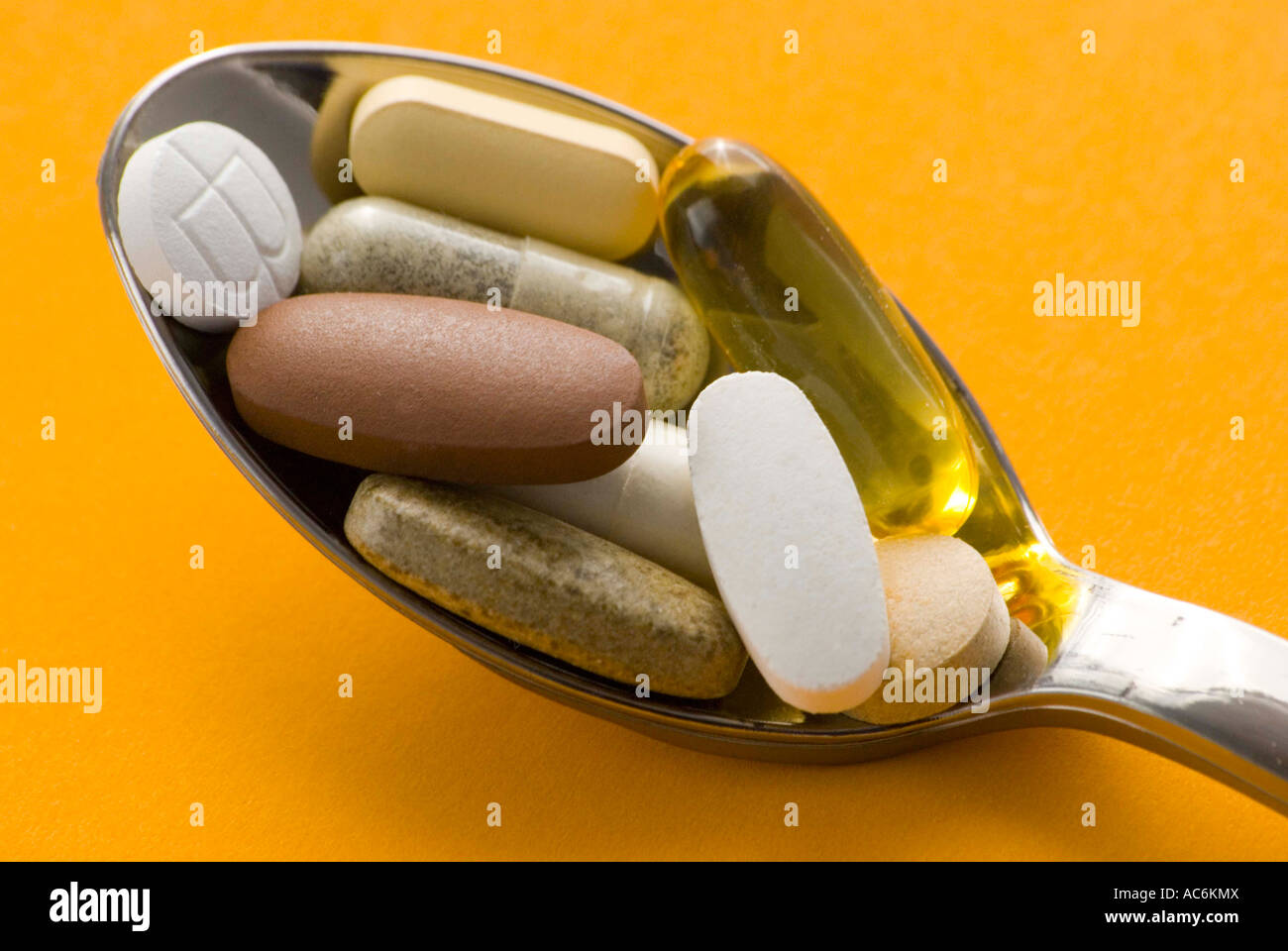 A spoonful of vitamin supplements Stock Photo - Alamy