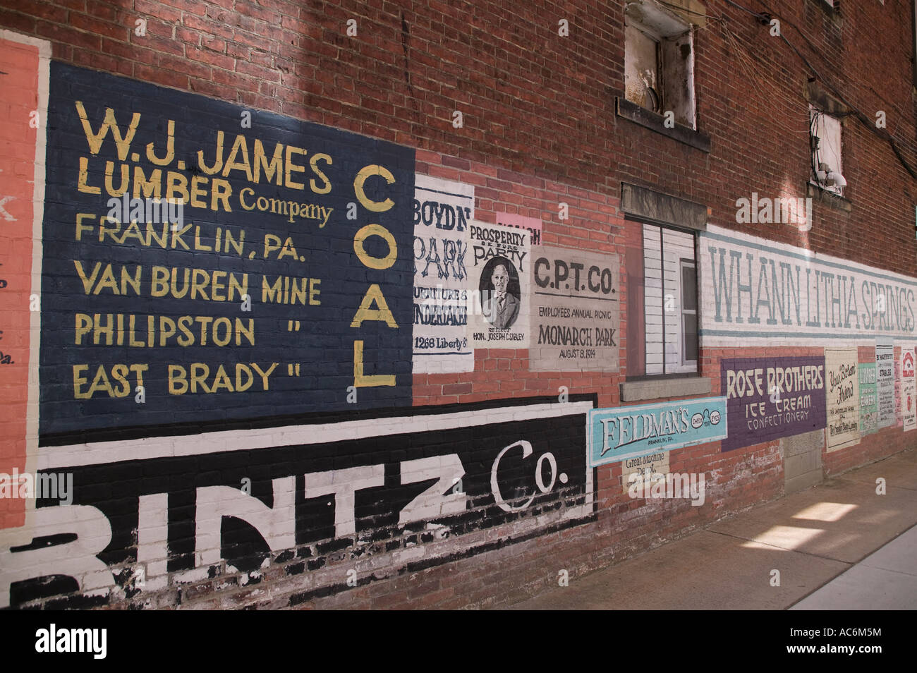Old signs advertising local goods have been repainted to look new ...
