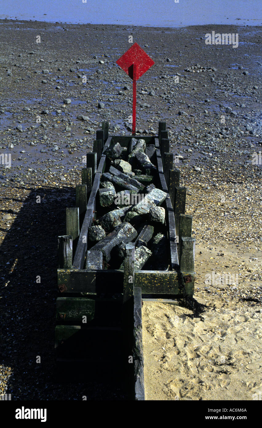 Sea defence groyne on the beach at Harwich, Essex, UK Stock Photo - Alamy