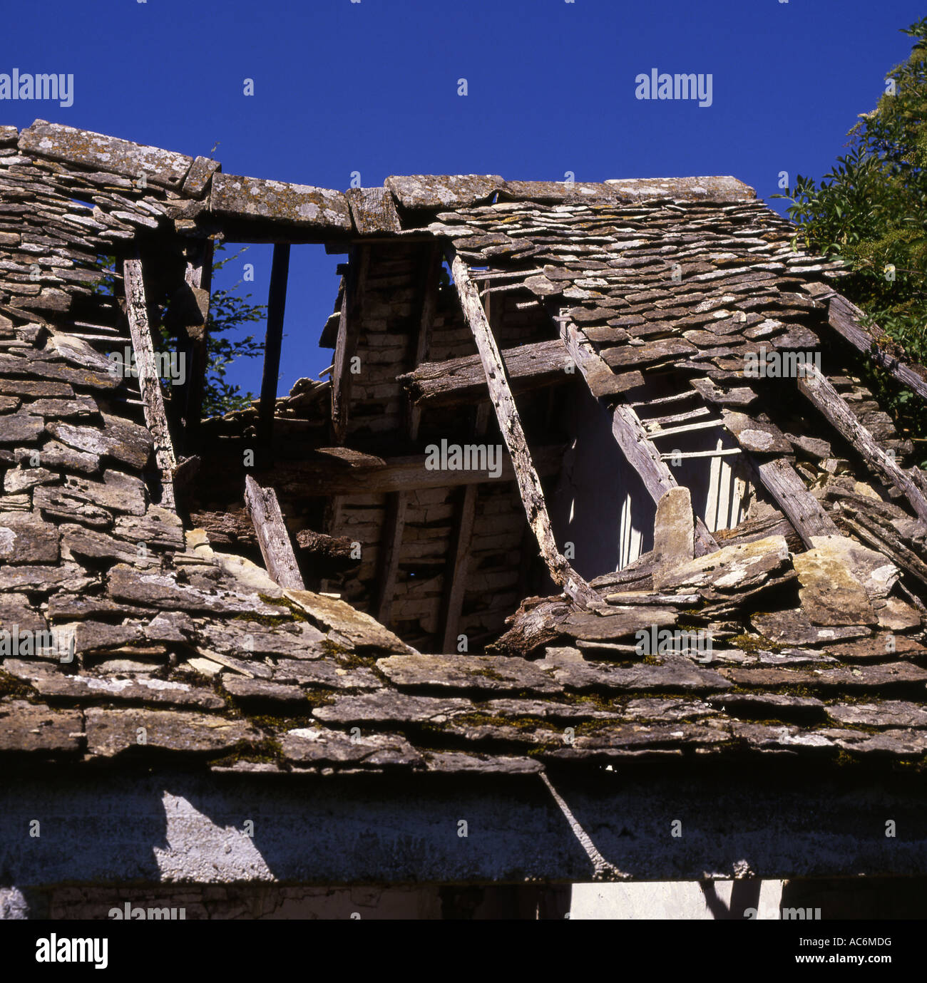 Disused and ruined building with broken roof in Bibury Gloucestershire ...