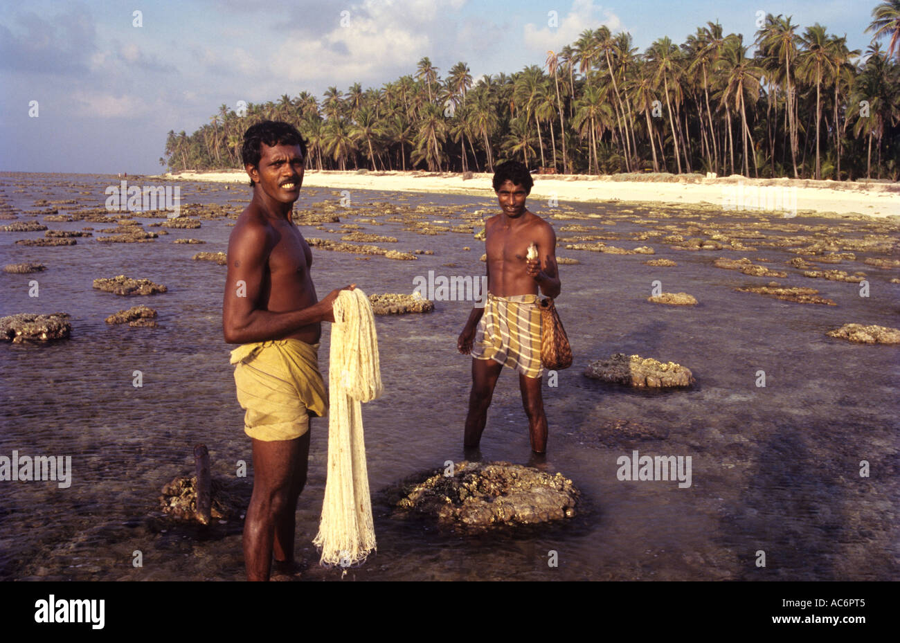 VILLAGERS FISHING FOR OCTOPUS DURING LOW TIDE ANDROTT Stock Photo - Alamy