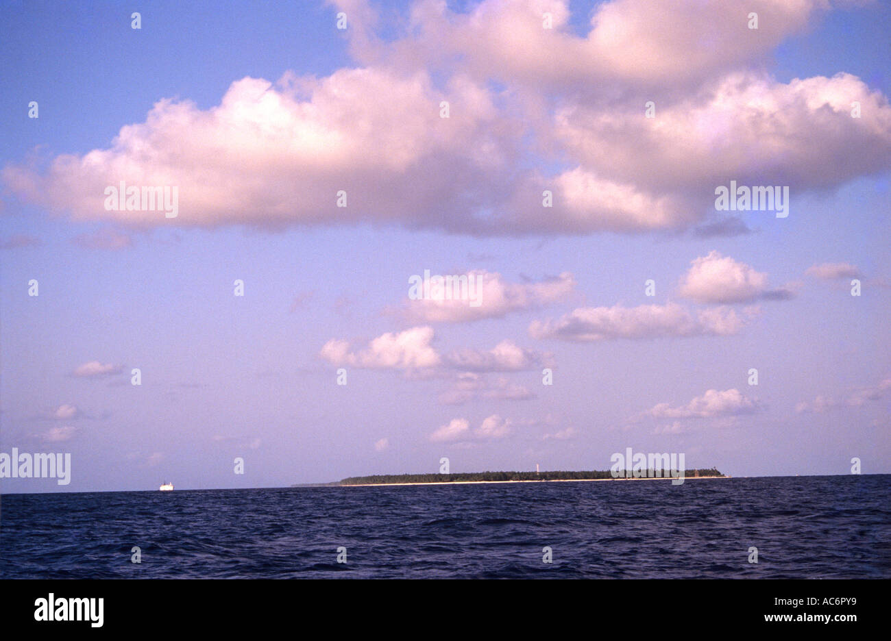 ANDROTT ISLAND AND SHIP ANCHORED OUTSIDE CORAL WALL Stock Photo - Alamy