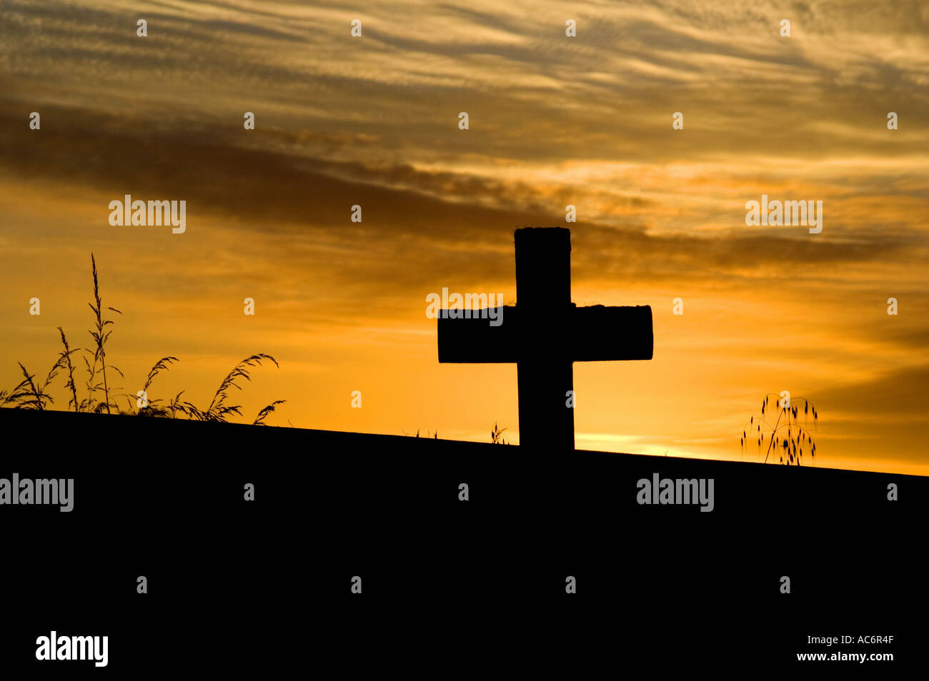 Cross in the dawn sunlight Stock Photo - Alamy