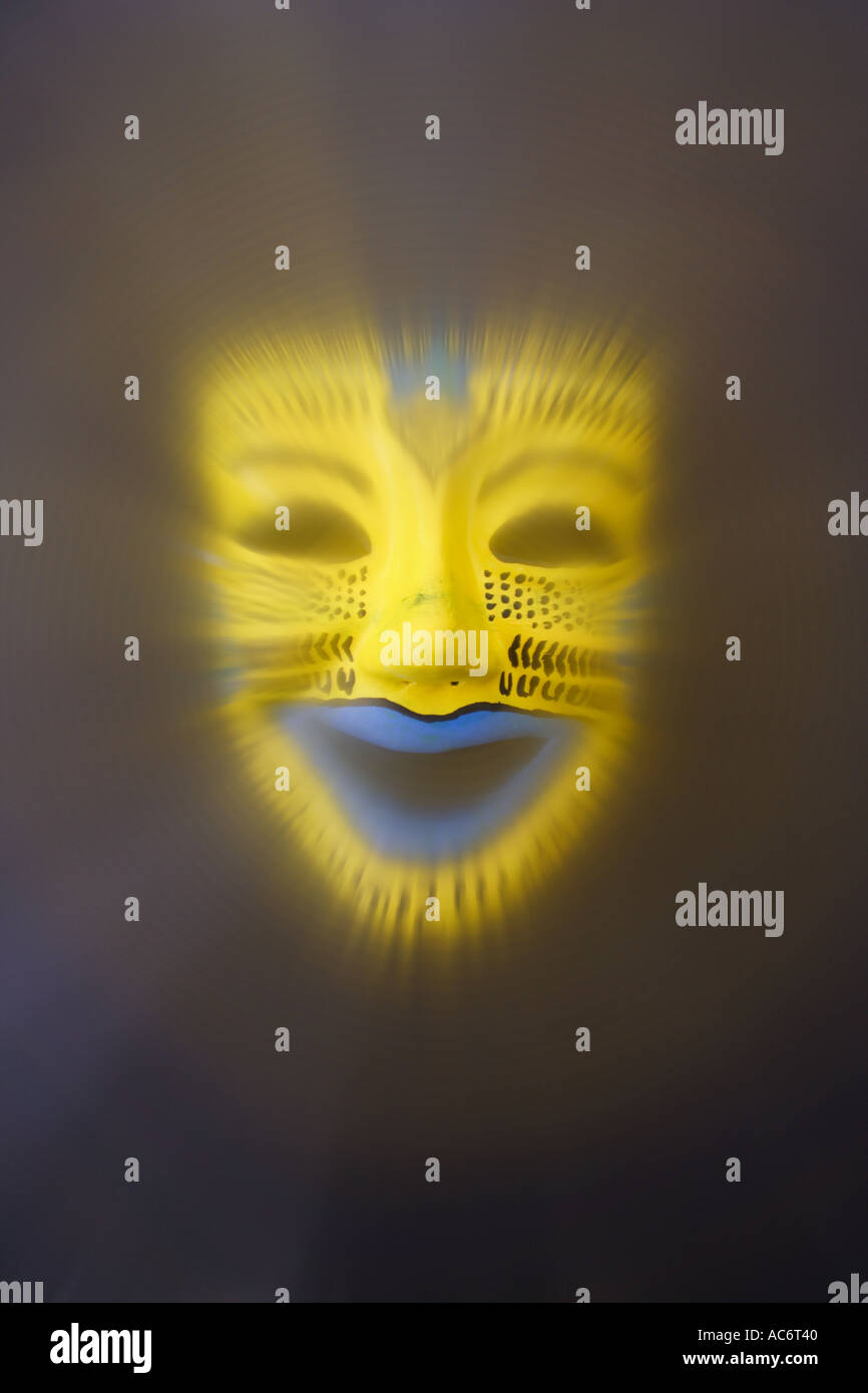 YELLOW AND BLUE PAINTED MASK BLACK BACKGROUND BAPD2363 Stock Photo - Alamy