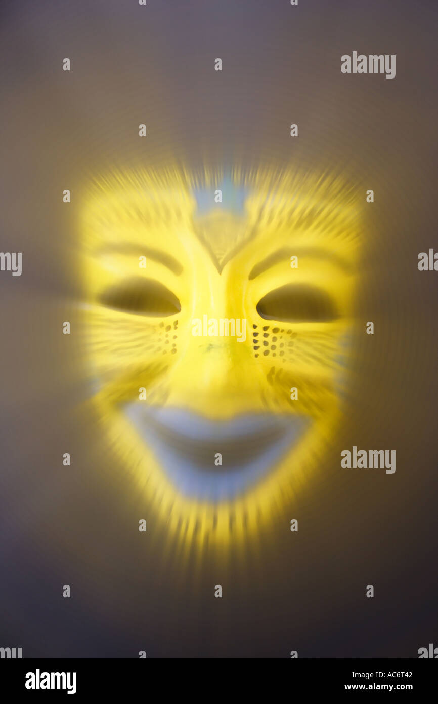 YELLOW AND BLUE PAINTED MASK BLACK BACKGROUND BAPD2364 Stock Photo - Alamy