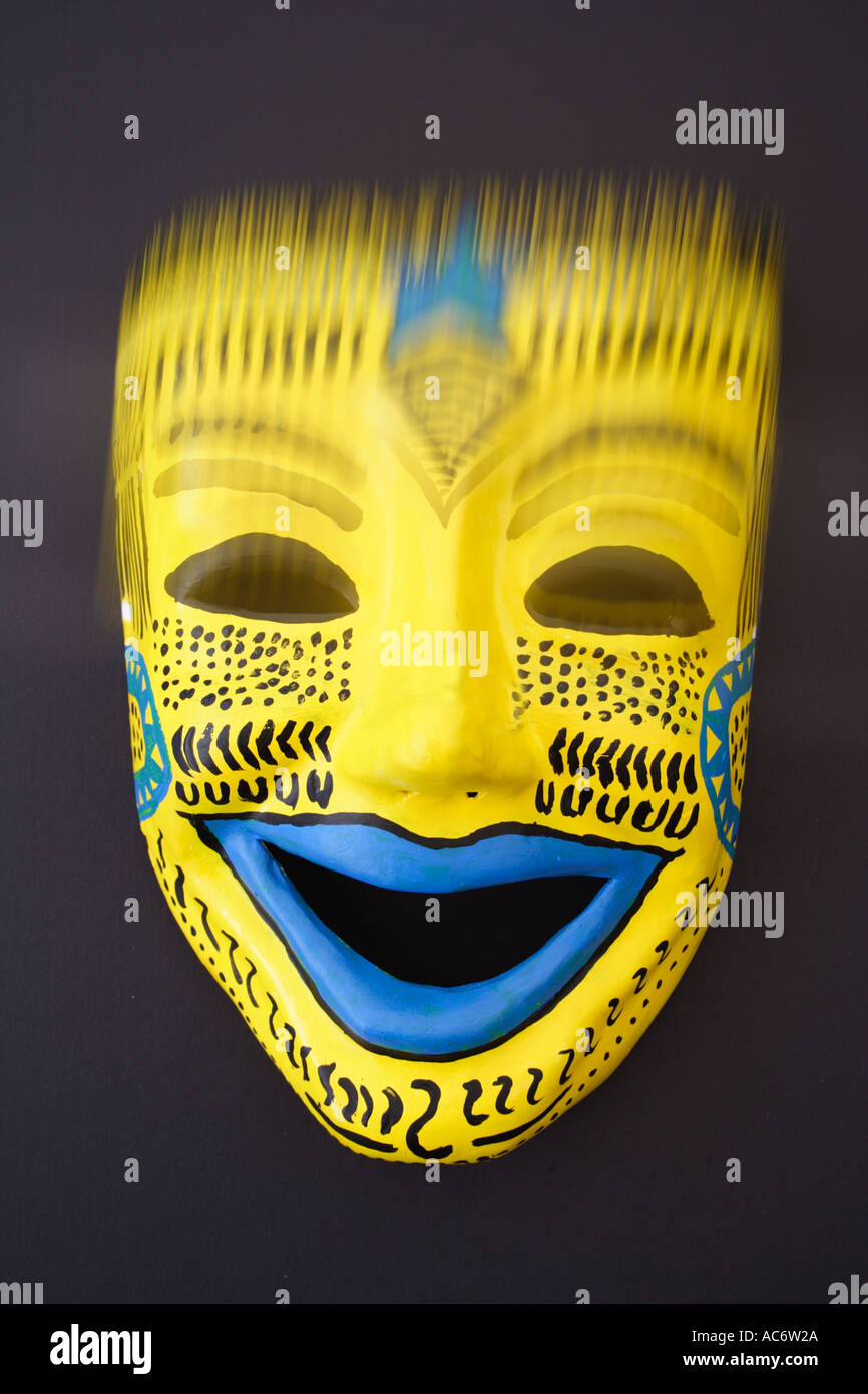 YELLOW AND BLUE PAINTED MASK BLACK BACKGROUND BAPD2376 Stock Photo - Alamy