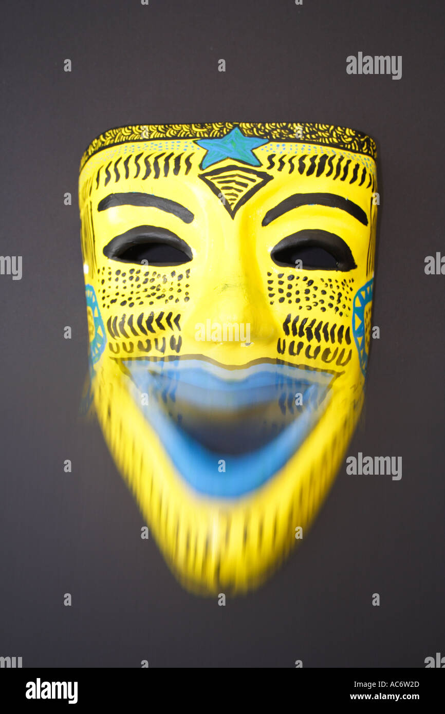 YELLOW AND BLUE PAINTED MASK BLACK BACKGROUND BAPD2377 Stock Photo - Alamy