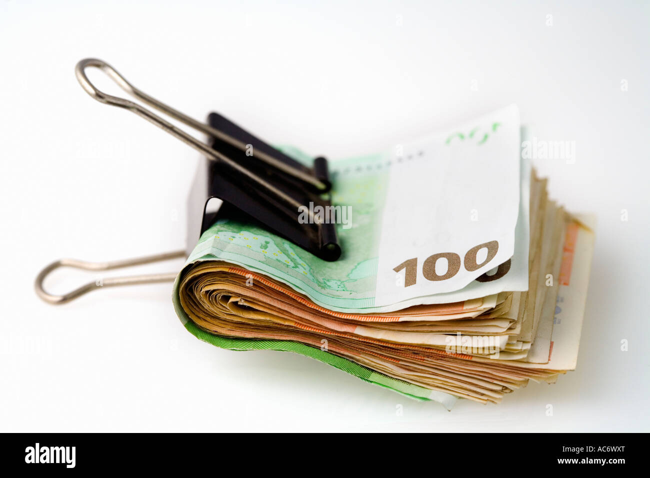 Bundle euro bills held hi-res stock photography and images - Alamy