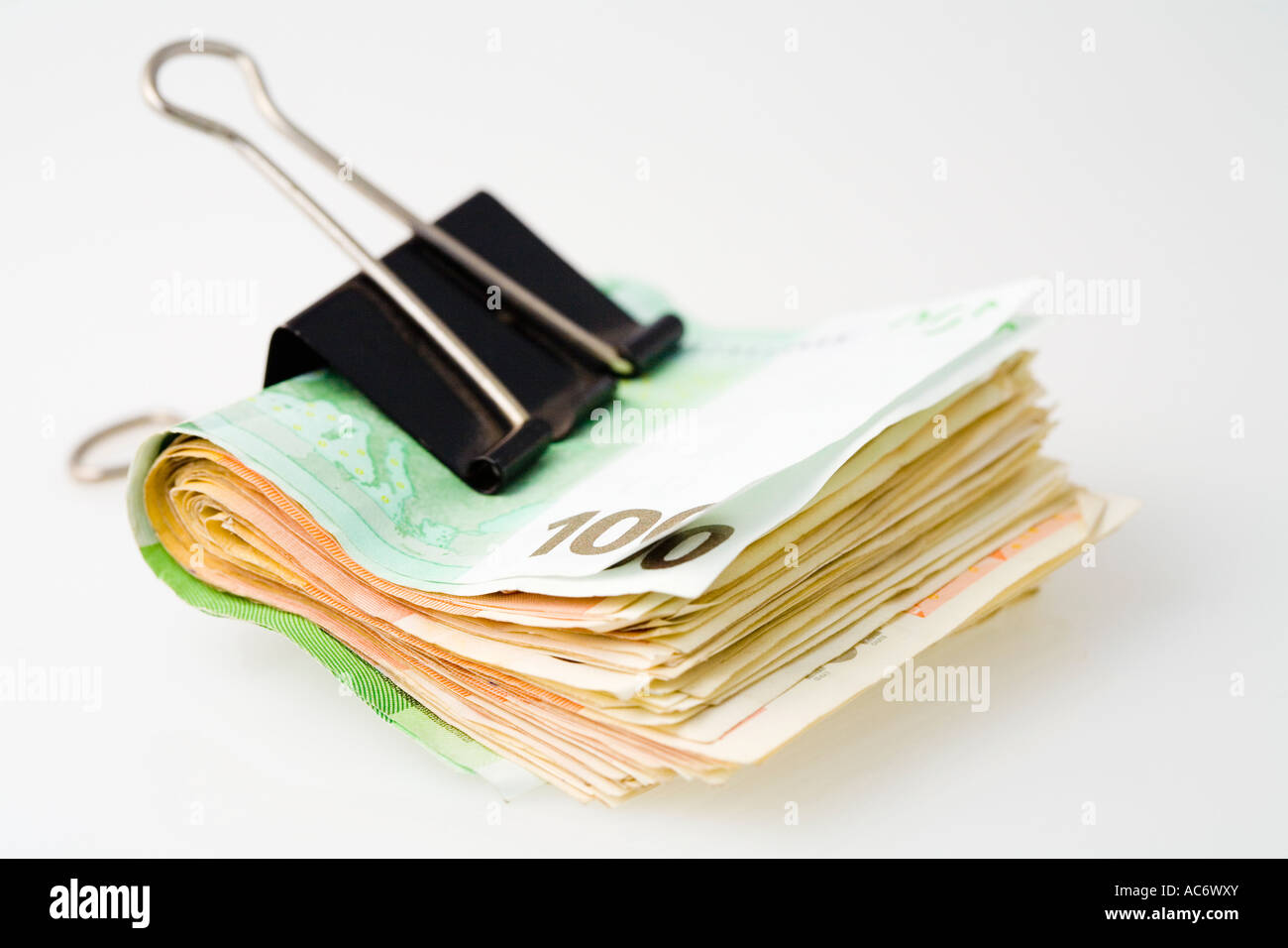 Bundle of Euro notes held together by clip Stock Photo - Alamy