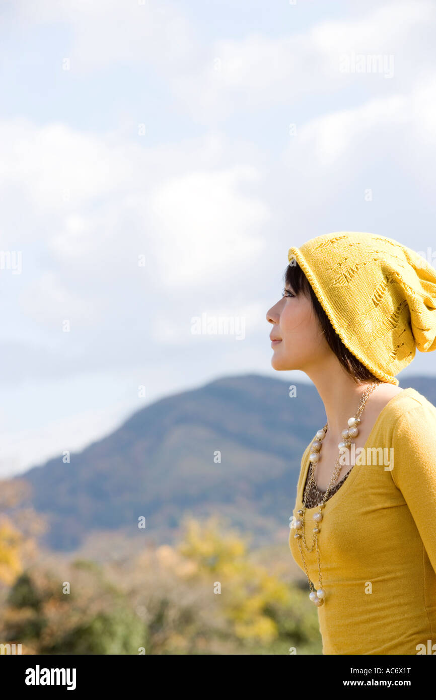 Young woman looking up Stock Photo - Alamy