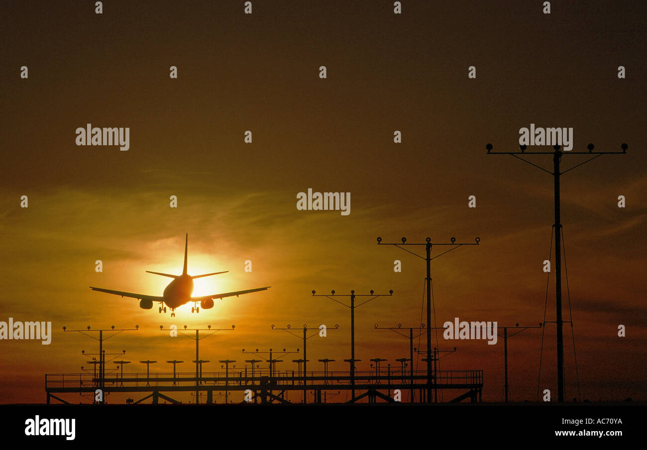 A Boeing 737 passes across the setting sun during last seconds before ...