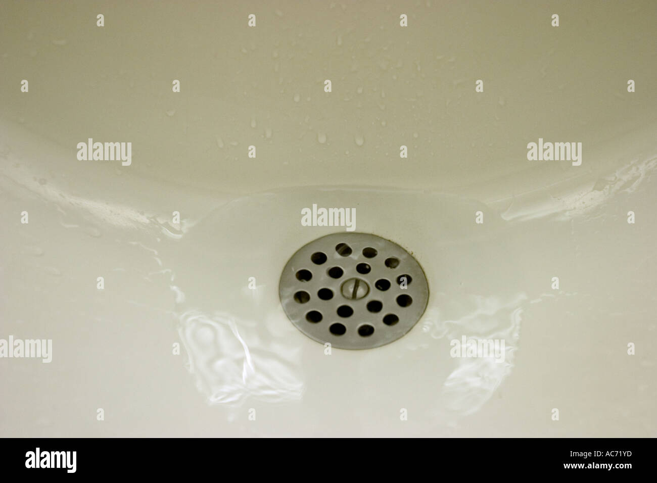 water running down a plug hole Stock Photo - Alamy