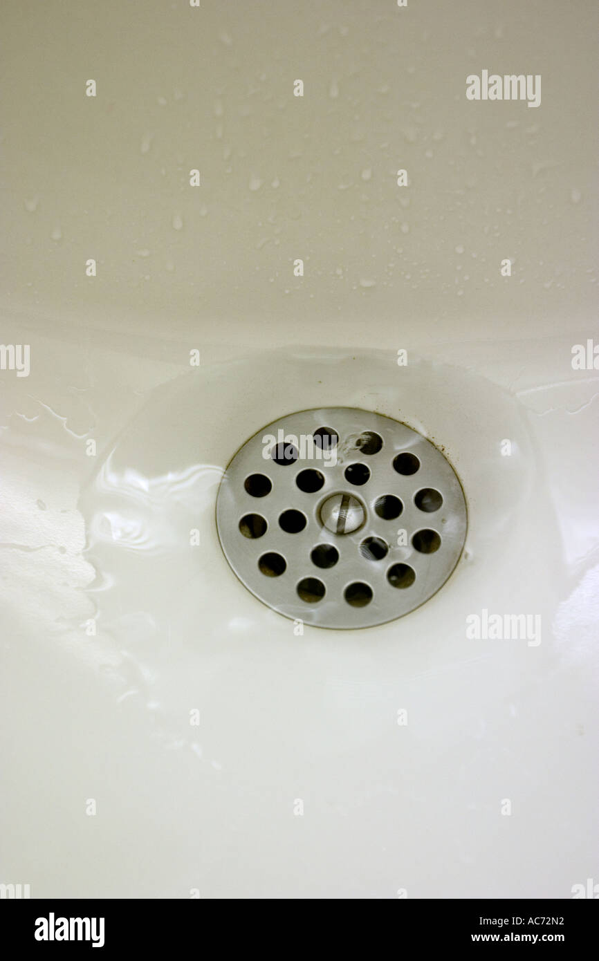 water running down a plug hole Stock Photo - Alamy