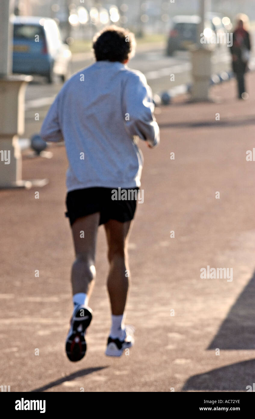 back of man jogging Stock Photo - Alamy