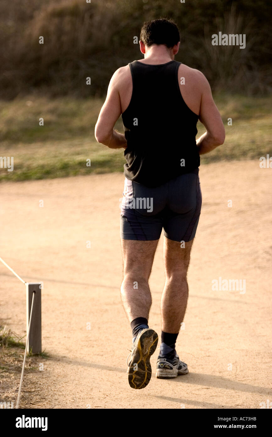 back of man jogging Stock Photo - Alamy