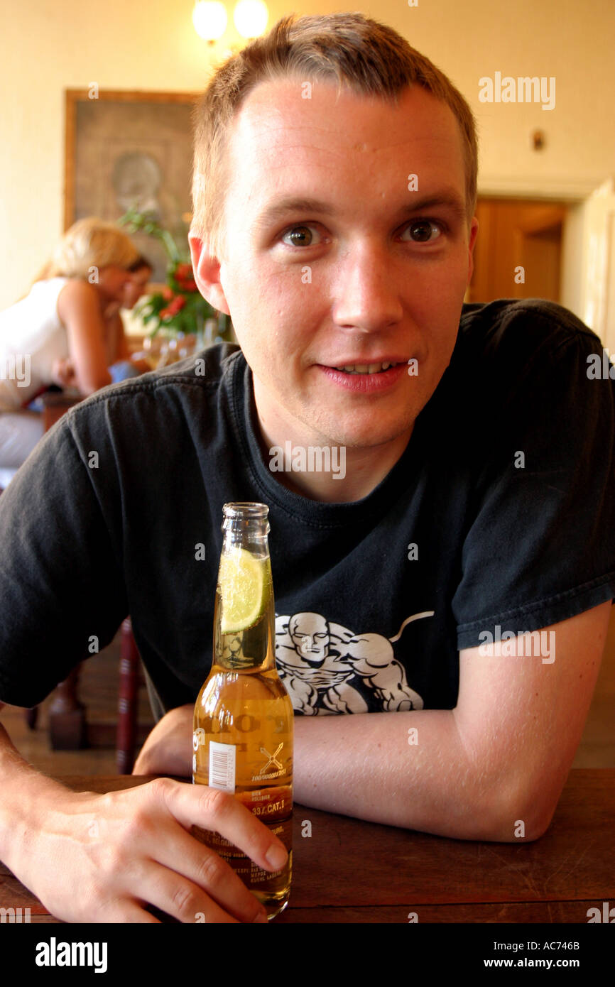 Young Man drinking beer Stock Photo - Alamy