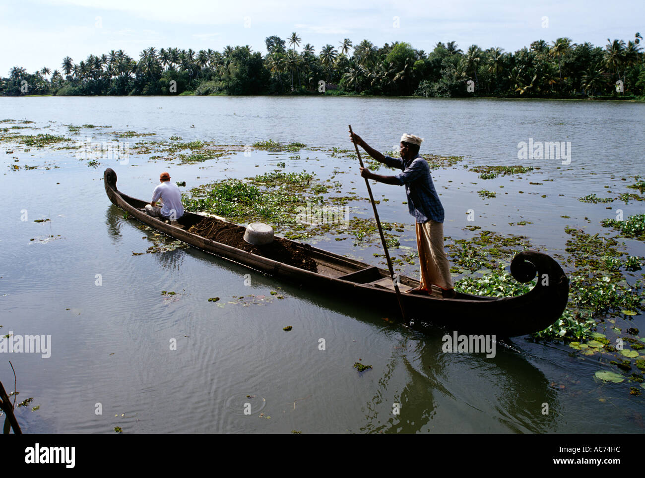 COUNTRY BOAT WITH TOURIST MOVING ACROSS KUTTANAD CANAL Stock Photo - Alamy