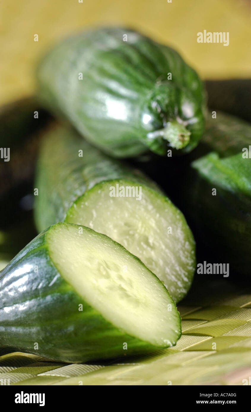 Whole and cut cucumbers Stock Photo - Alamy