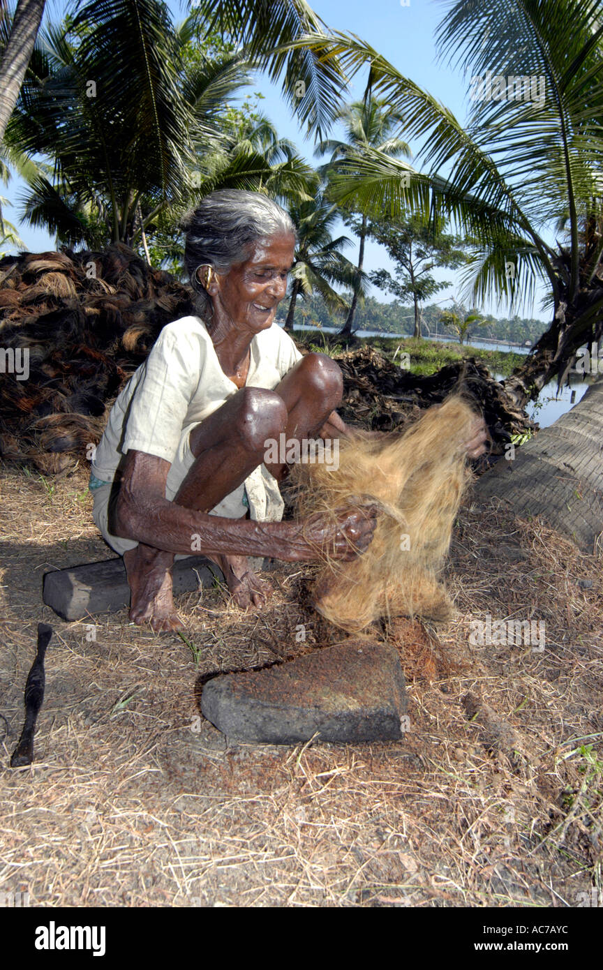 COCONUT FIBRE EXTRACTION IN THE TRADITIONAL WAY BY BEATING THE OUTER ...