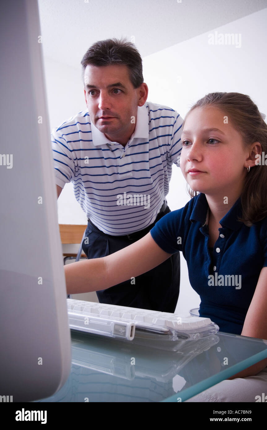 Father and daughter at computer Stock Photo - Alamy