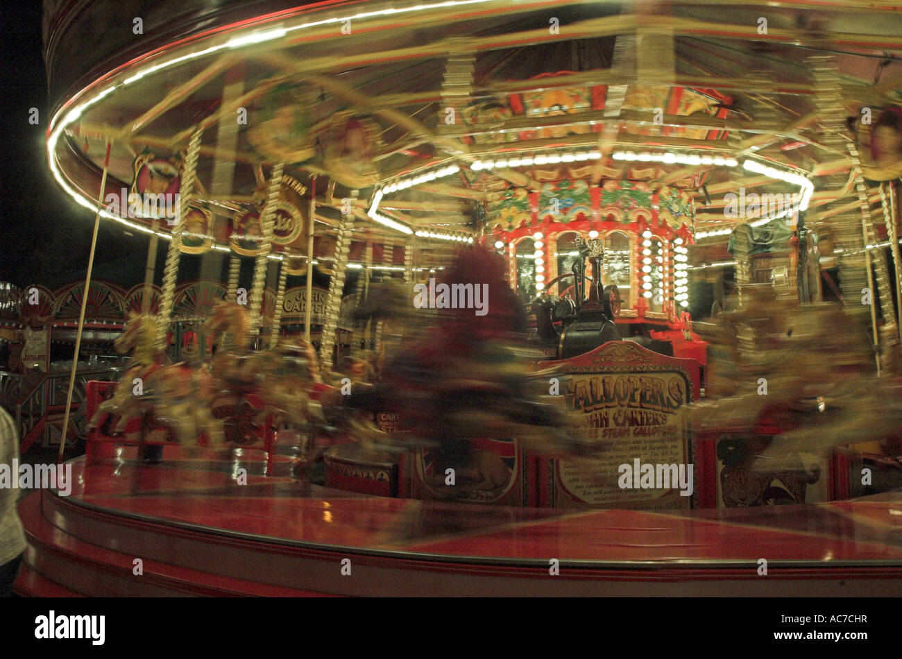 Carousel lit at night Stock Photo - Alamy