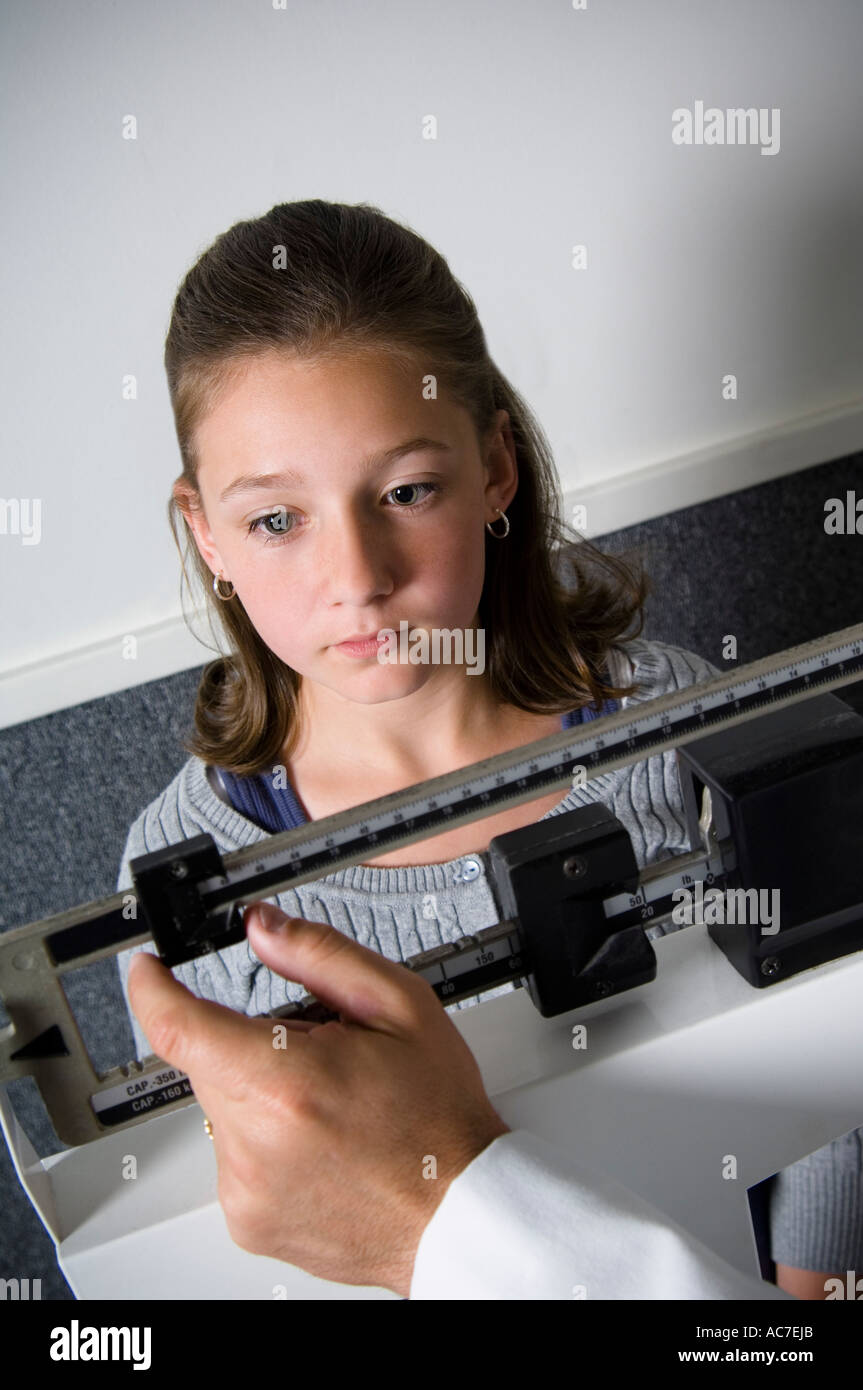 Girl on scale Stock Photo - Alamy
