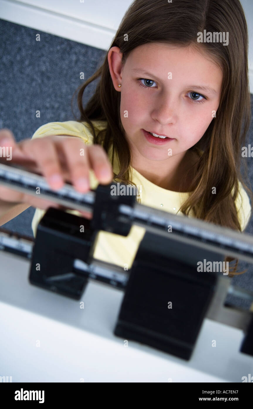 Nurse weighing patient on scale hi-res stock photography and images - Alamy