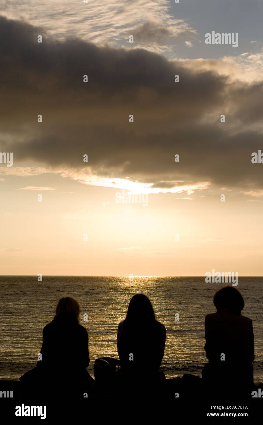 Three women silhouette behind hi-res stock photography and images - Alamy
