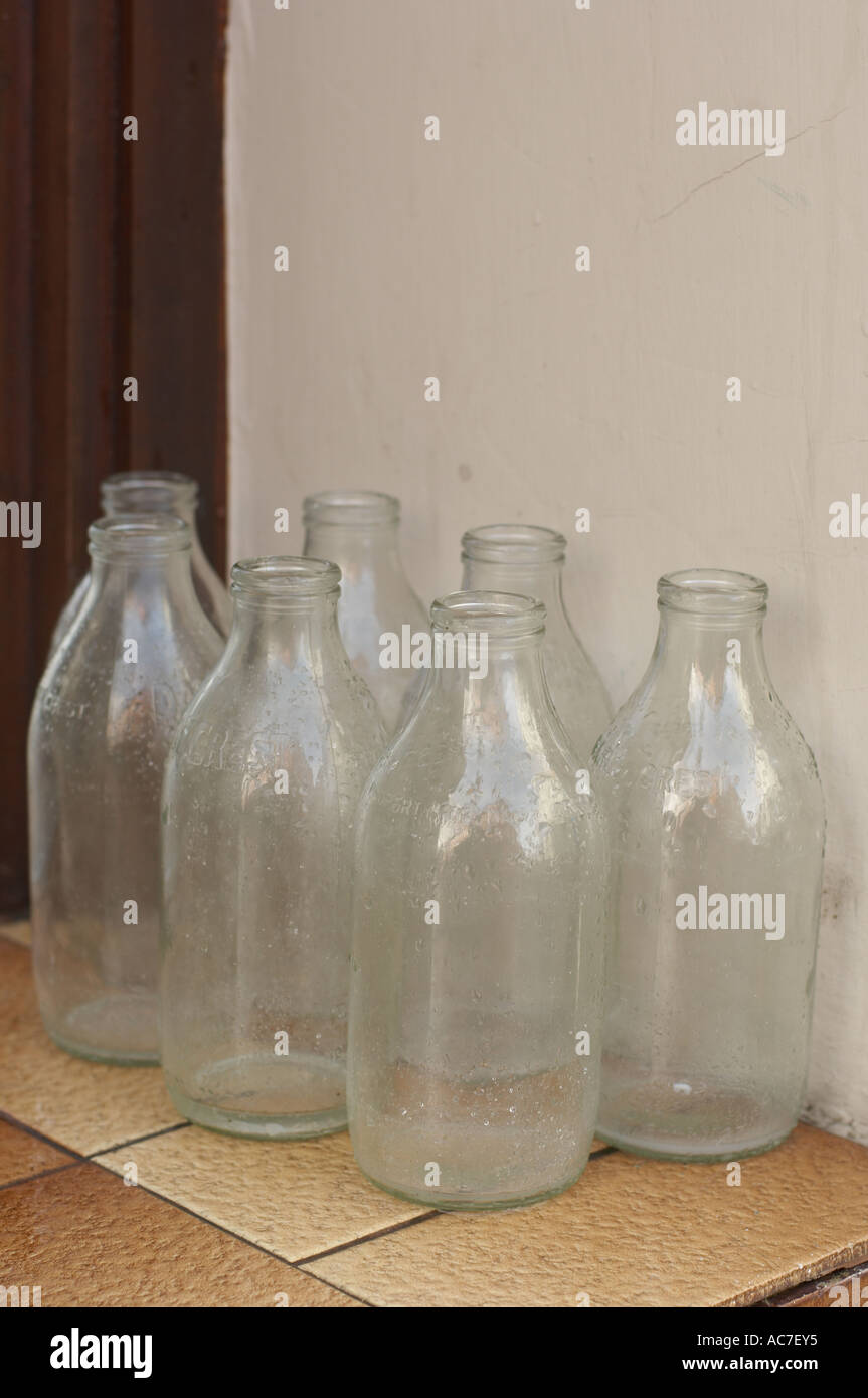 7 Seven pint Milk bottles awaiting collection on a doorstep , UK Stock ...