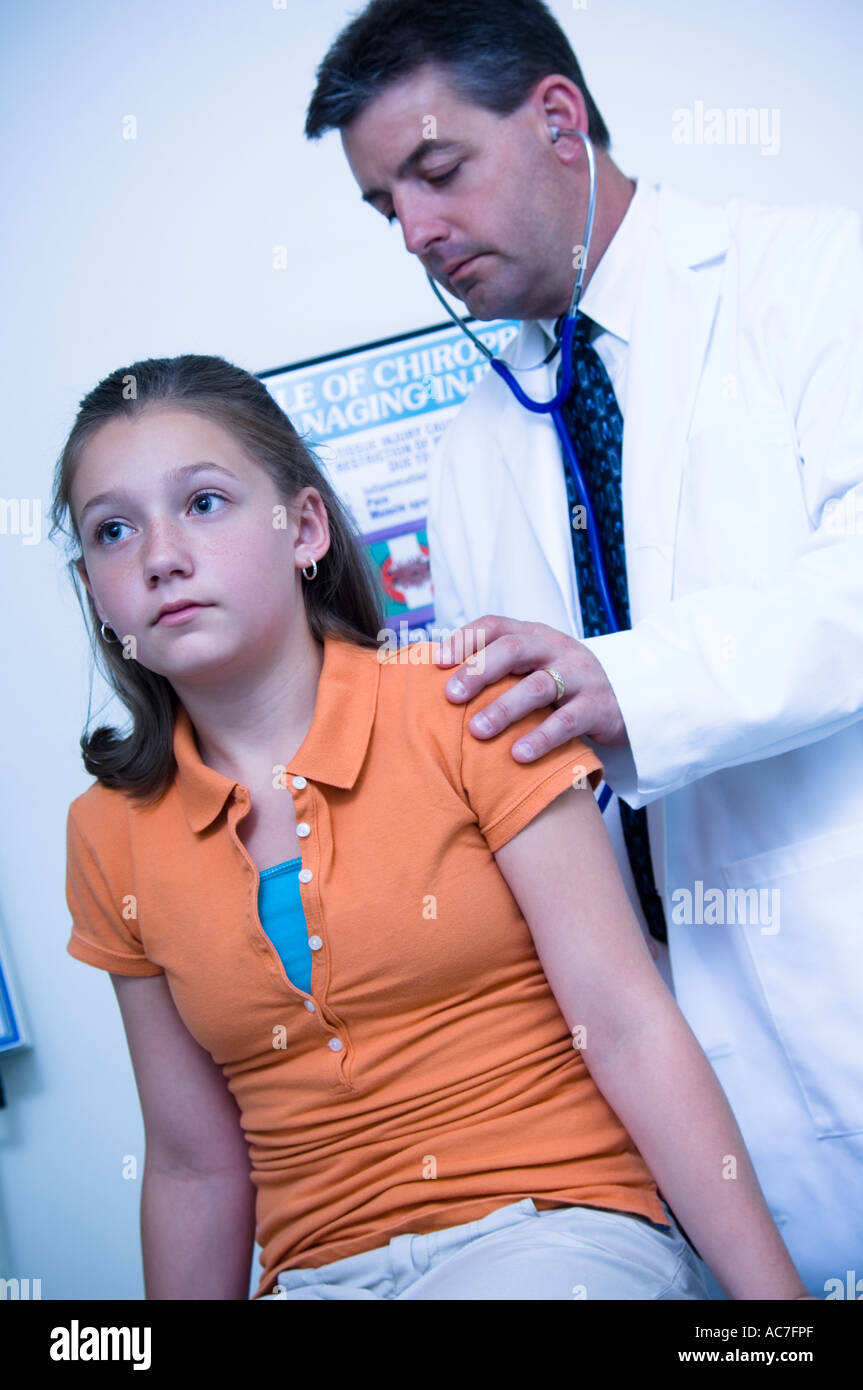 Girl getting physical examination hi-res stock photography and images ...