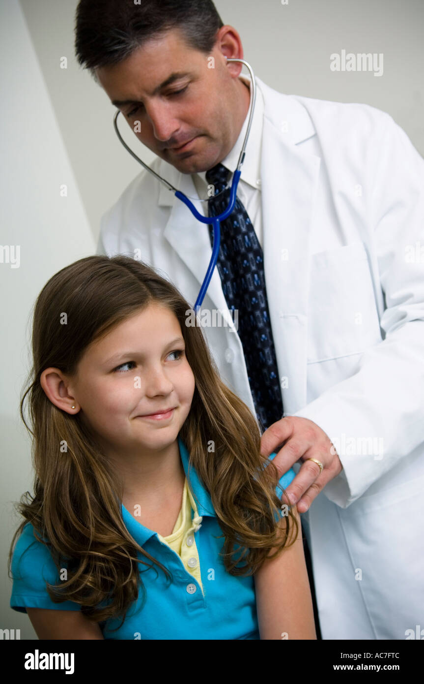 Girl getting physical examination hi-res stock photography and images ...