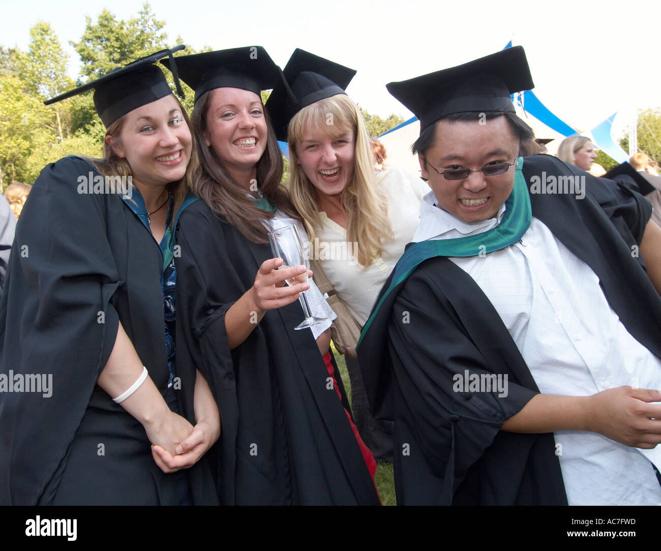 Four university graduates smiling hi-res stock photography and images ...