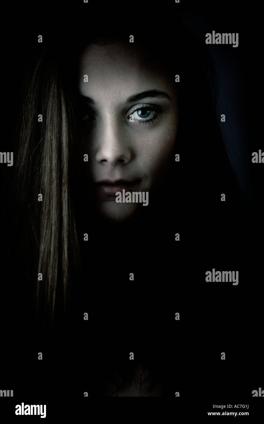 Portrait of a girl with her face partially obscured by her hair Stock ...