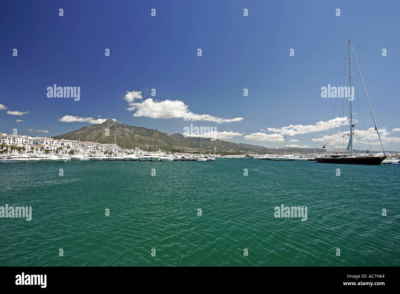 Stunning landscape views across clear waters of port or harbour in ...