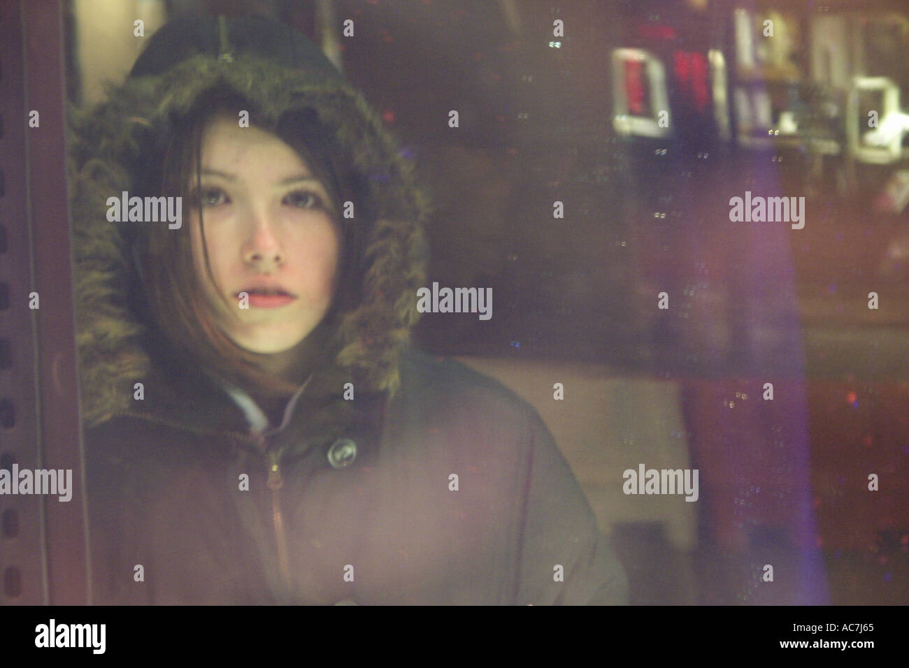 reflection of a girl window shopping at harrods christmas display ...
