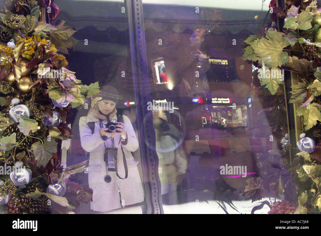 strange double exposure of photographer photographing harrods christmas ...