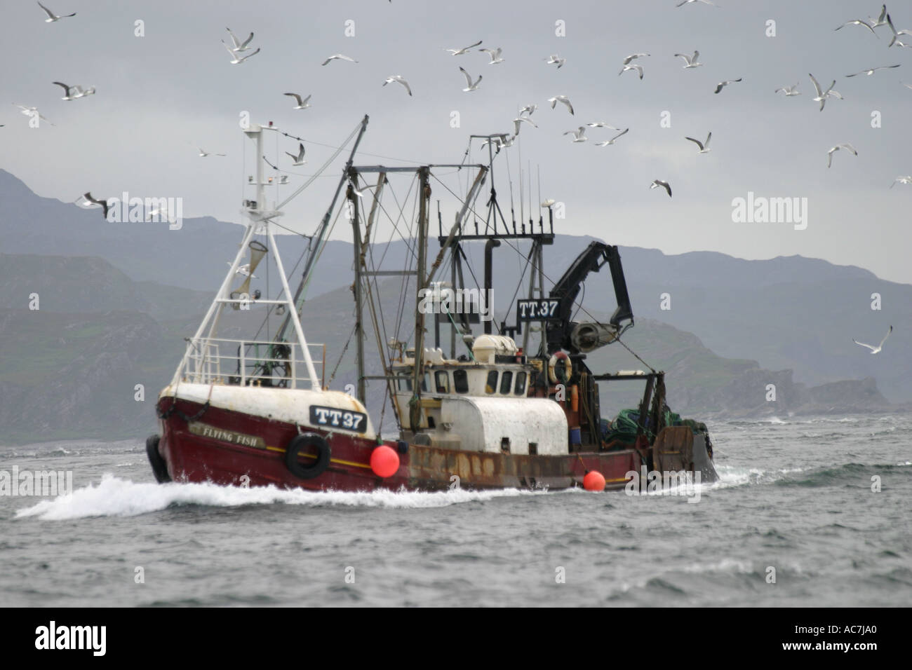 A fishing trawler operating off the West Coast of Scotland Stock Photo ...