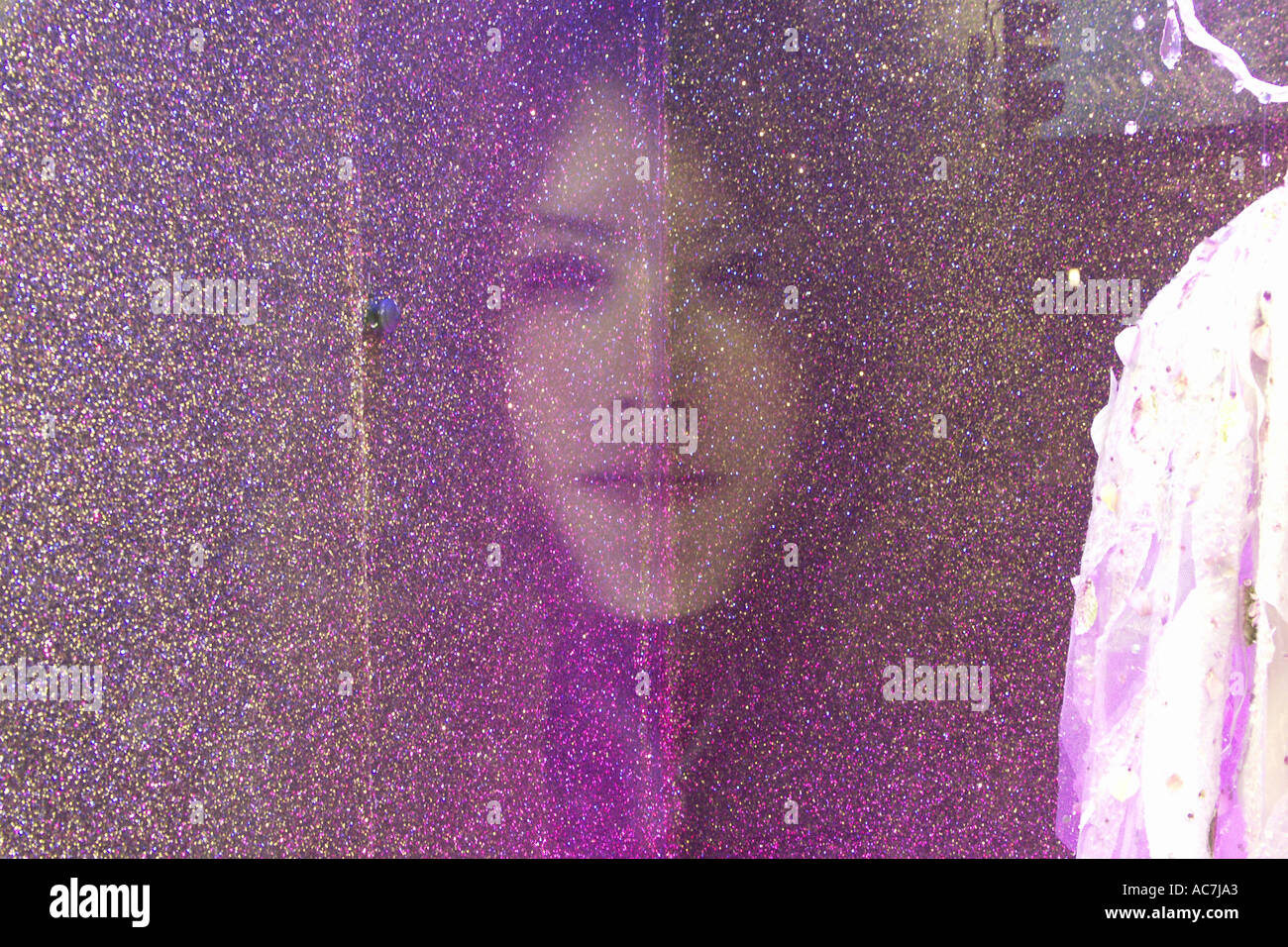 reflection of girls face in Harrods department store christmas window ...