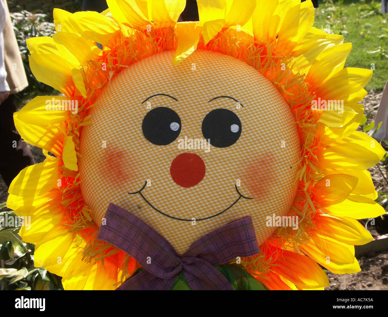 Sunflower scarecrow in the children’s garden at the spring flower show ...