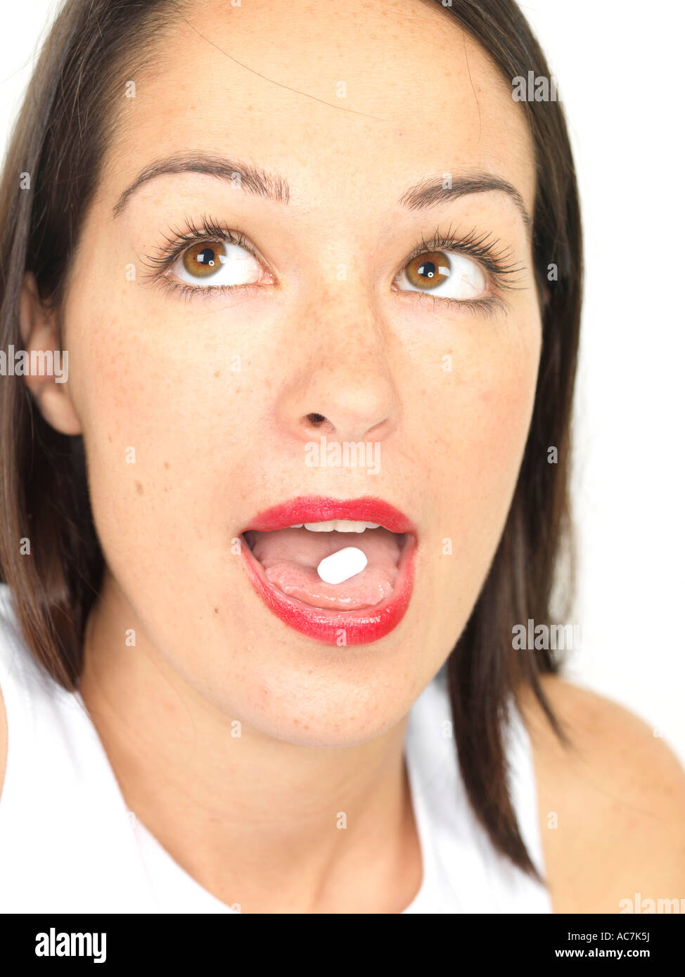 Young Woman Taking Pill Model Released Stock Photo - Alamy