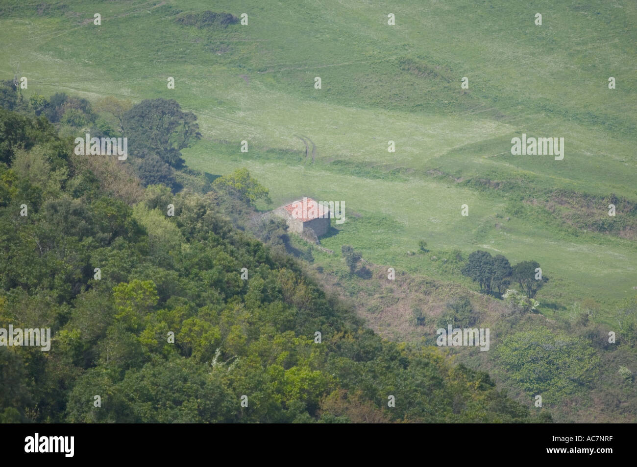 Old Basque farm building with red tile roof in countryside near the ...