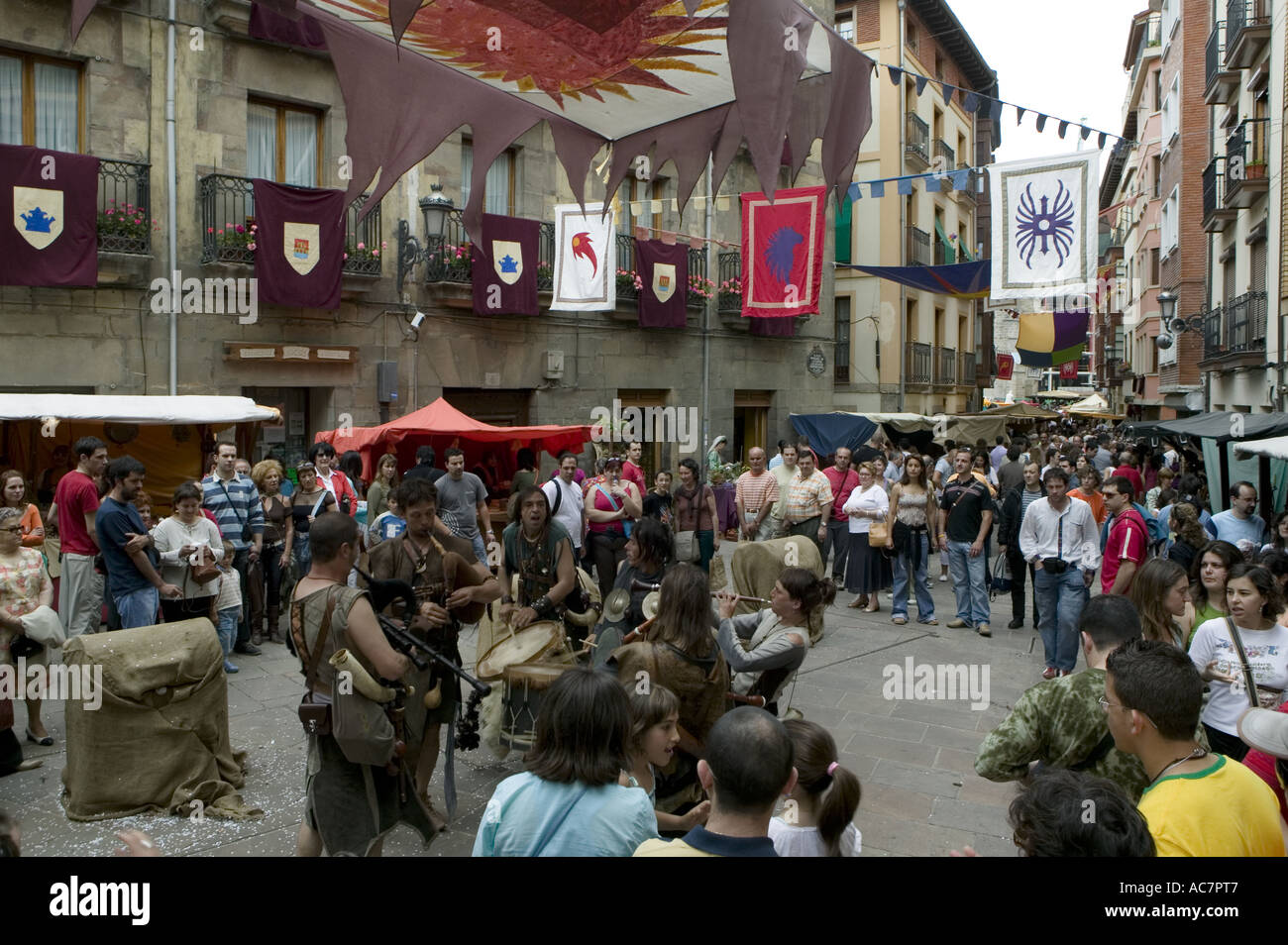 Group of musicians in period dress playing at a medieval market ...