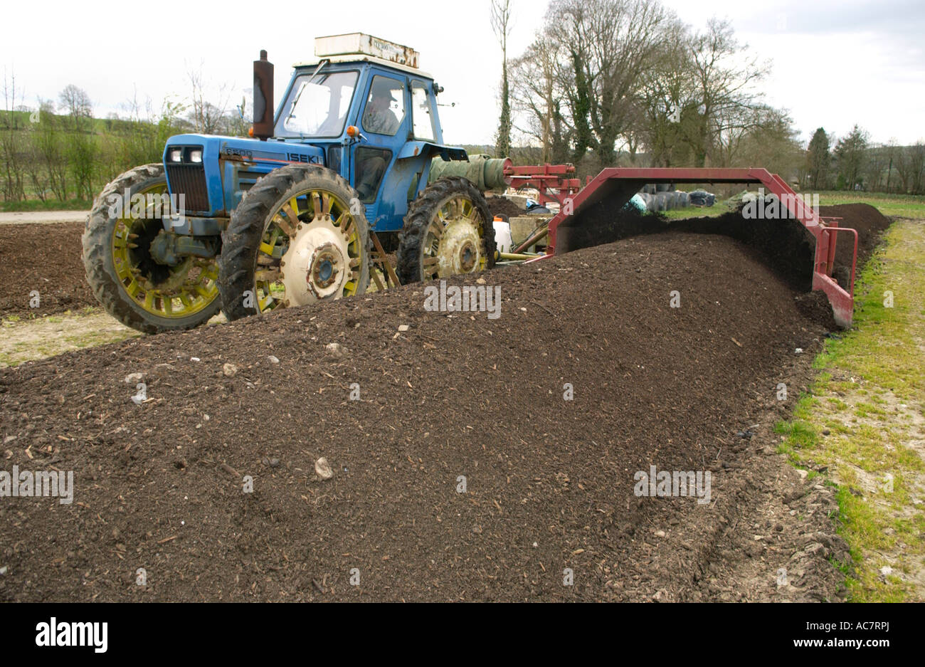 Tractor turning microbial compost heap on Blaen Camel Organic Farm ...
