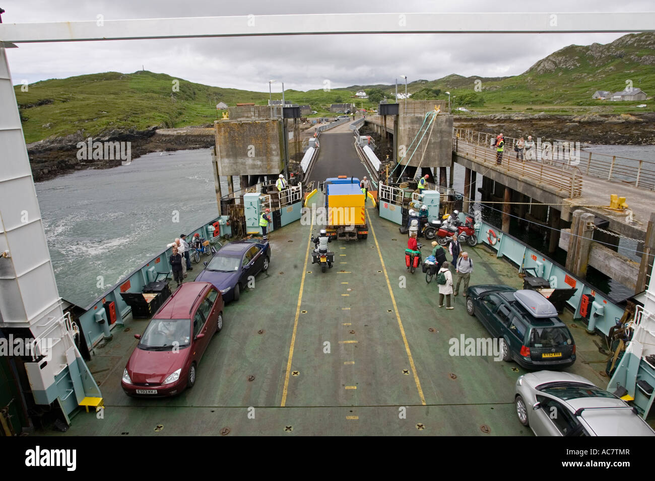 Cars leaving Calmac ferry Scalasaig harbour Isle of Colonsay Scotland ...