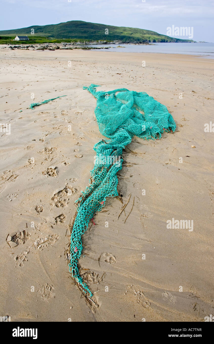 Discarded fishing net washed up on beach Kintra Isle of Islay Scotland ...