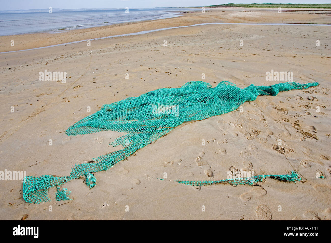 Discarded fishing net washed up on beach Kintra Isle of Islay Scotland ...